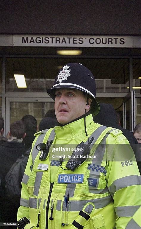 A British Police Officer Waits Outside Of Ipswich Magistrates Court