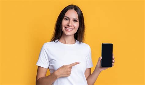 Premium Photo Happy Woman Pointing Finger At Mobile Phone Woman