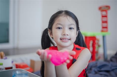 Asian Girl Hands Playing Slime Toy Making Slime Premium Photo