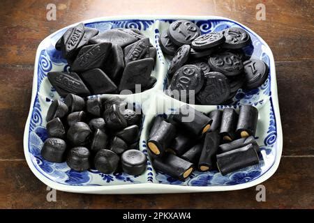 Dutch Licorice Candies On A Delftware Plate Isolated On White