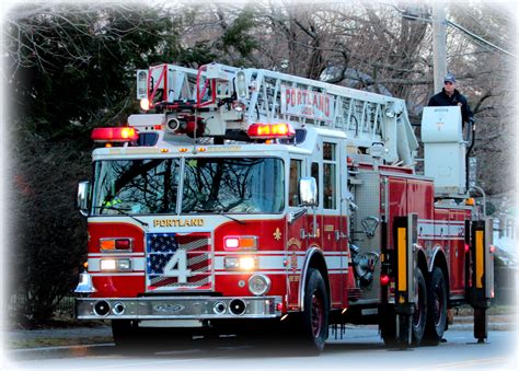 Portland Fire Setting Up Ladder Trucks To Hang American Flag Across