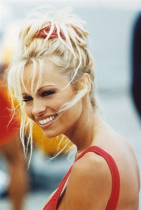 Pamela Anderson Debuts New Fiery Red Hair At Paris Fashion Week