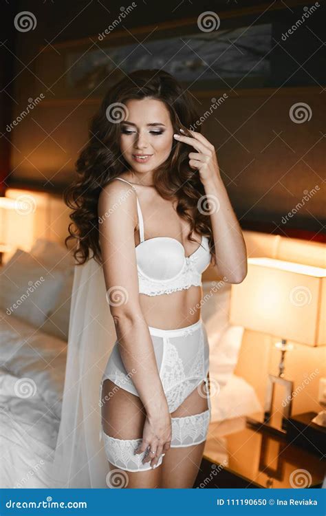 And Young Brunette Model Girl In Lingerie And Stockings With Sporty