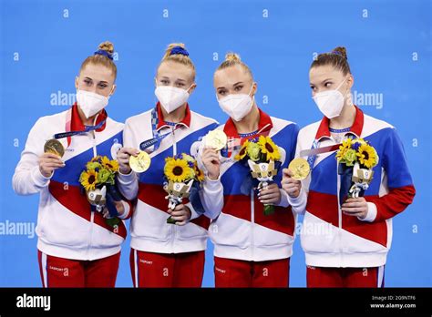 Russian Olympic Committee Gymnasts Pose With Their Gold Medals After