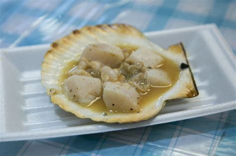 Seafood Shell And Fish Cooked On A Grill At The Osaka Fish Market In