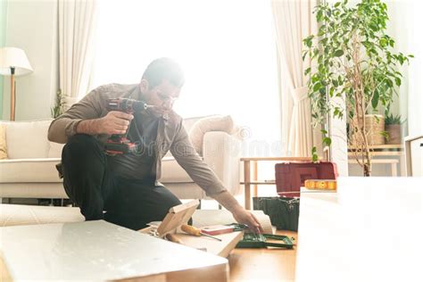 Professional Furniture Assembly Worker Assembles Shelf Professional Handyman Doing Assembly Job
