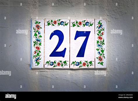27 Number Twenty Seven Blue Digits On Floral Tiles Vignetted Stock