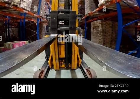Forklift Fork Close Up The Load Lifter Rides On The Warehouse Pov