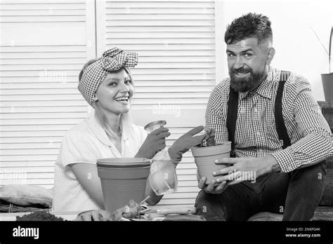 Young And Happy Couple In Love Planting And Have Fun Together Loving