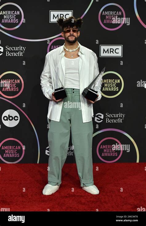 Bad Bunny Poses In The Press Room With The Awards For Favorite Latin