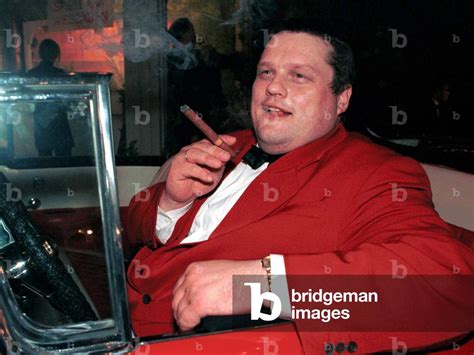 Image Of German Weightlifter Manfred Nerlinger Sits In A Car While Smoking