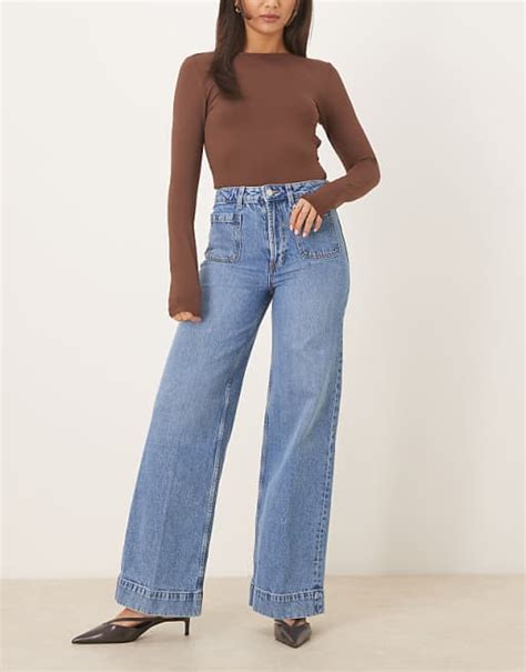 Asos Design High Waist Wide Leg Jeans With Front Pockets In Mid Wash Asos