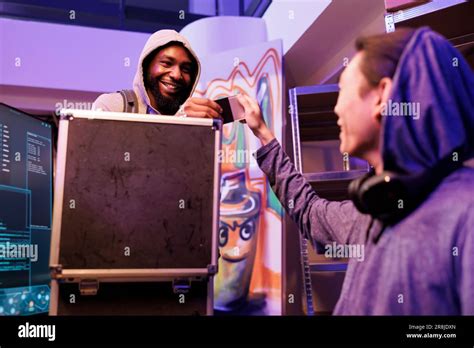 Smiling Hacker Bringing Ssd With Computer Virus In Abandoned Warehouse