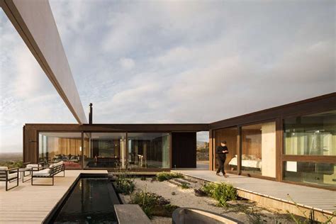 Ribbed Raulí Exterior Cladding Meeting Laminated Pine Structures • Artfasad