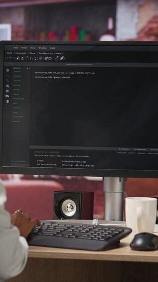 Vertical It Technician In Home Office Looking At Ui On Computer Monitor Executing Programming
