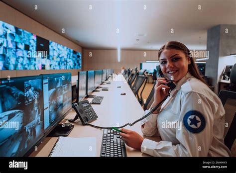 Female Security Operator Working In A Data System Control Room Offices Technical Operator