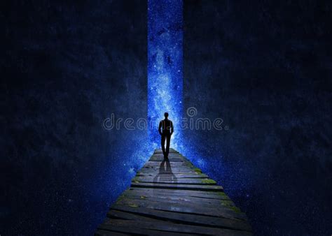 Silhouette Of Man Walking Through A Passageway Through The Universe