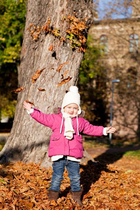 Cute Littloe Girl Playing Outdoor In Autumn Stock Photo Image Of Lifestyle Funny