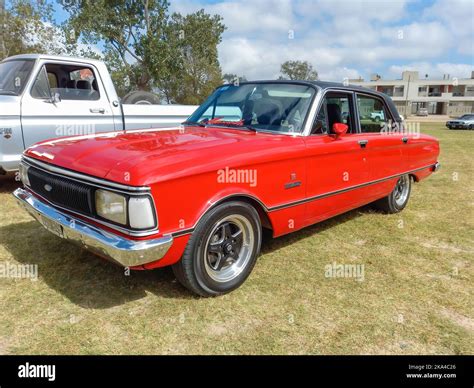 Old Red Falcon Futura Sp Four Door Sedan 1980 In The Countryside