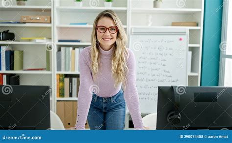 Young Blonde Woman Teacher Smiling Confident Standing At Classroom