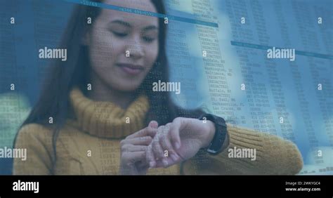 Image Of Data Processing Over Biracial Woman Using Smartwatch Stock