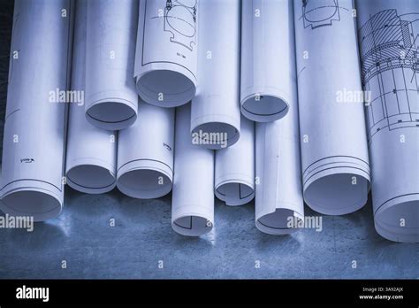 Variety Of Engineering Blueprints On Scratched Metallic Background Building And Architecture