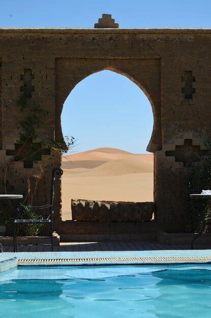 Premium Photo Swimming Pool With Desert In Background