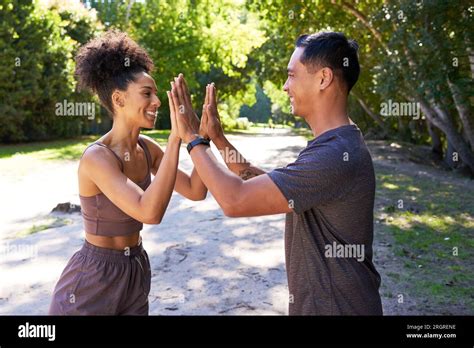 Beautiful Fit Couple Give Each Other Double High Five After Trail Run