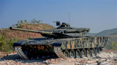 Modern Military Tank With Camouflage Pattern In A Field Premium Ai