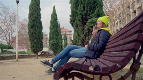 A Girl Sits On A Park Bench Stock Footage Video Of Girl Vacation