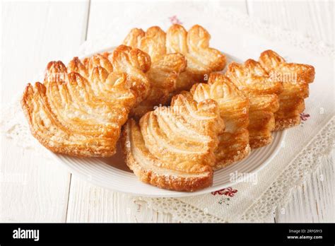 Homemade Gourmet Italian Puff Pastries Palmine Closeup On The Plate On The Table Horizontal