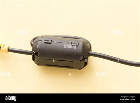 Close Up Of A Black Ferrite Bead Attached To A Cable Isolated On A