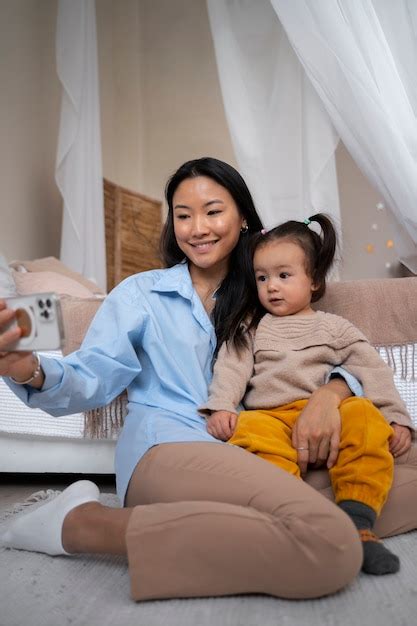 Free Photo Asian Mother And Daughter Spending Time Together At Home