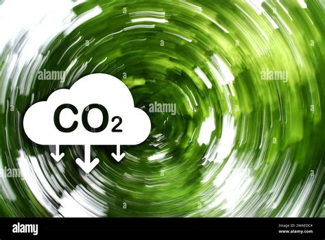 Co2 Reducing Icon And Rotating Blurred Green Forest Concept Of Co2