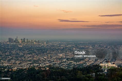 Aerial View Of From Downtown Los Angeles To Griffith Park At Sunset