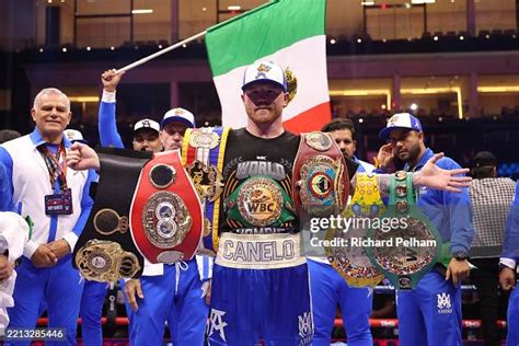 Saul Canelo Alvarez Poses For A Photo With His Belts After Beating