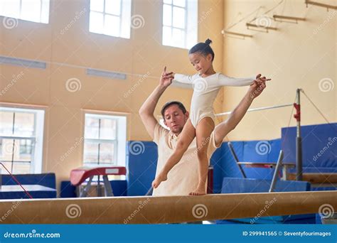 Coach Helping Young Gymnast On Balance Beam Stock Image Image Of