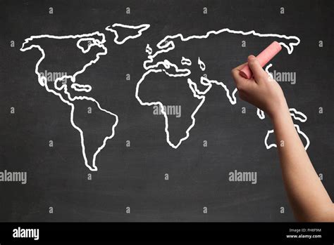 Adult Drawing World Map On Chalkboard Stock Photo Alamy