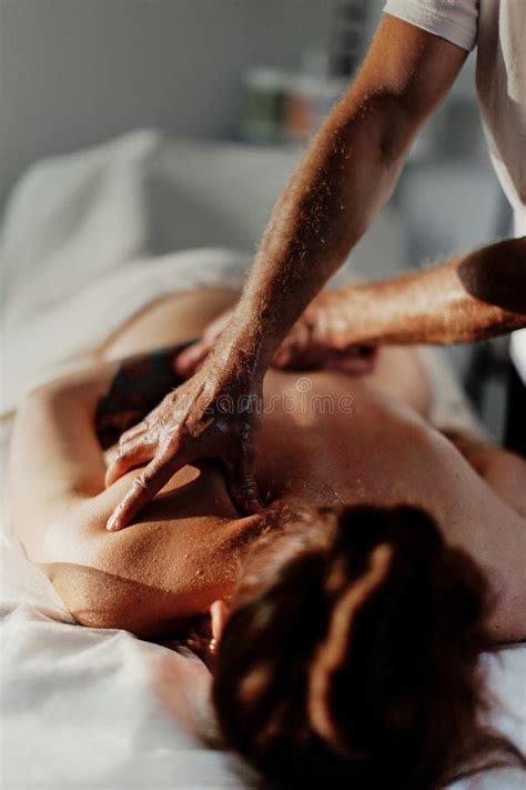 A Qualified Male Massage Therapist Massages The Clientand X27s Neck