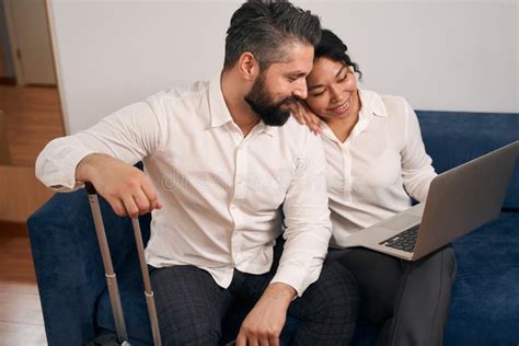 Tourist Couple Using Portable Computer In Their Hotel Room Stock Image