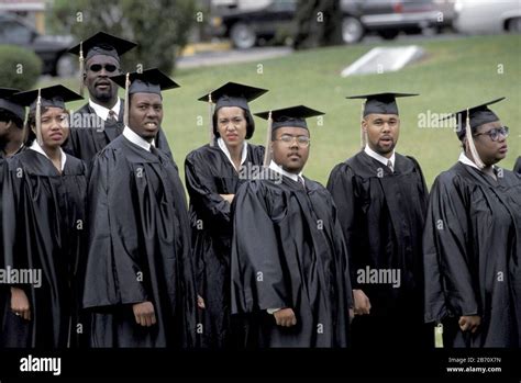 Austin Texas Usa Black Students Wearing Caps And Gowns Walk Towards