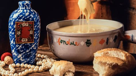 Download Delicious Cheese Fondue With Fresh Baked Bread Wallpaper