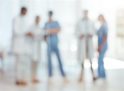 Premium Photo Group Of Doctors Nurses And Blurred Hospital Meeting