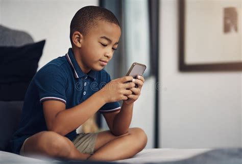 Theres Always Something To Keep Me Busy On Here A Young Boy Using A