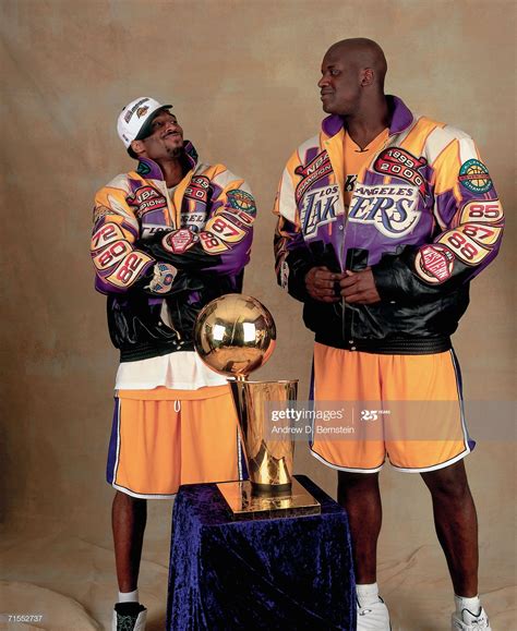 Shaquille Oneal And Kobe Bryant With The Nba Championship Trophy