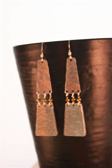 hinged hammered aluminum and crystal earrings by cindy larson accessories