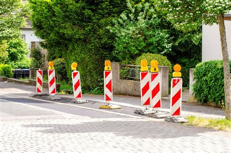 Road Work Safety Pylons With Flashing Lights On A Street In Iserlohn