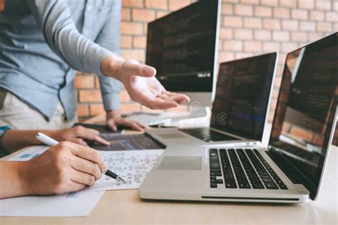 Team Of Professional Developer Programmer Cooperation Meeting And Brainstorming And Programming