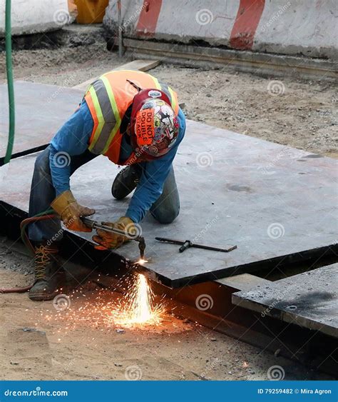 Construction Worker Using A Plate Compactor Editorial Image