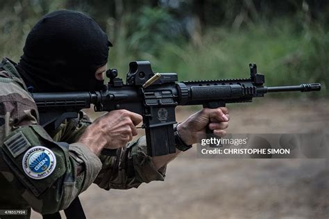 A Member Of The French Gign Special Forces Tries A Weapon Of The